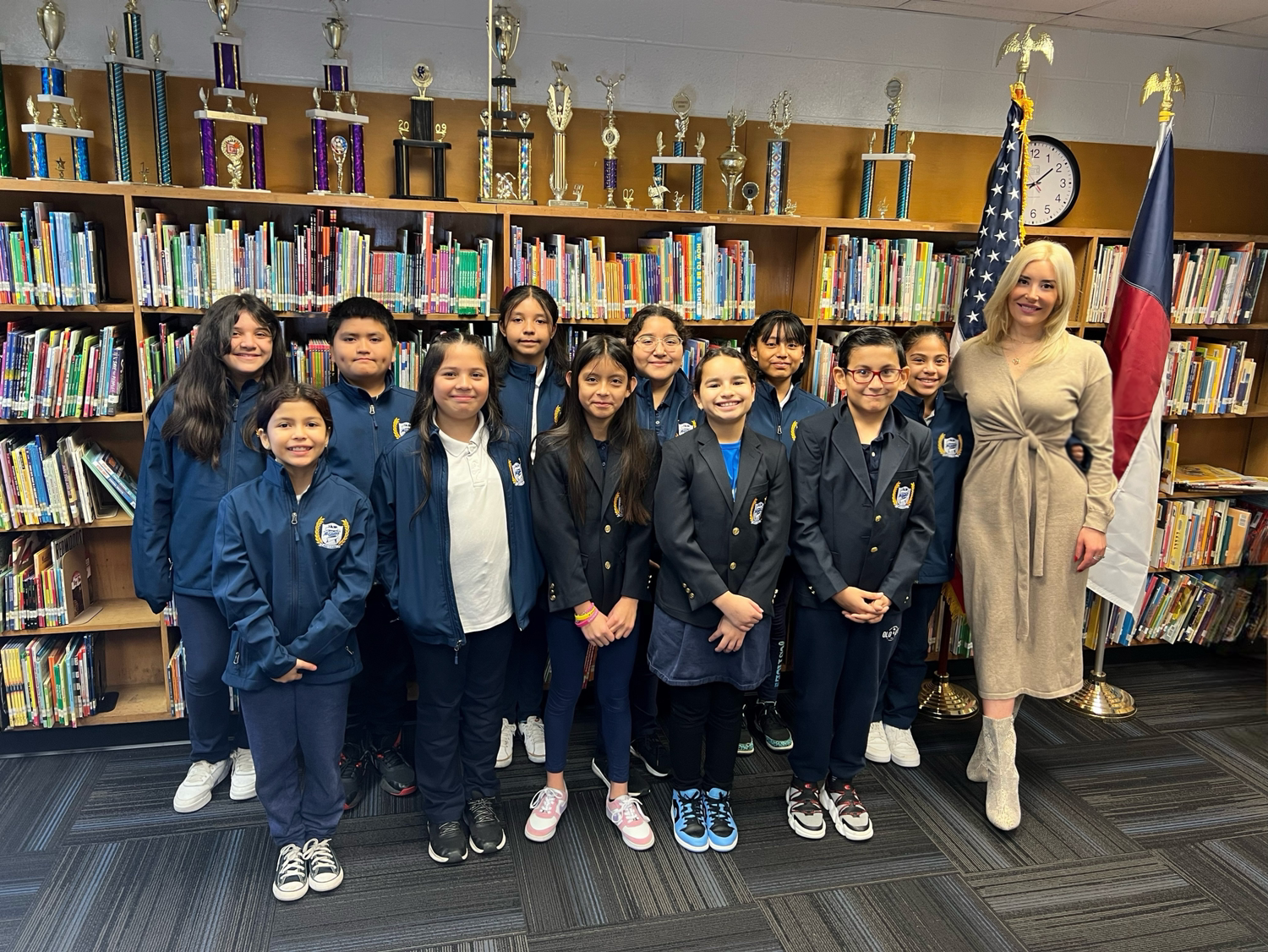 Teacher leads student news team that gives back to school and community ...